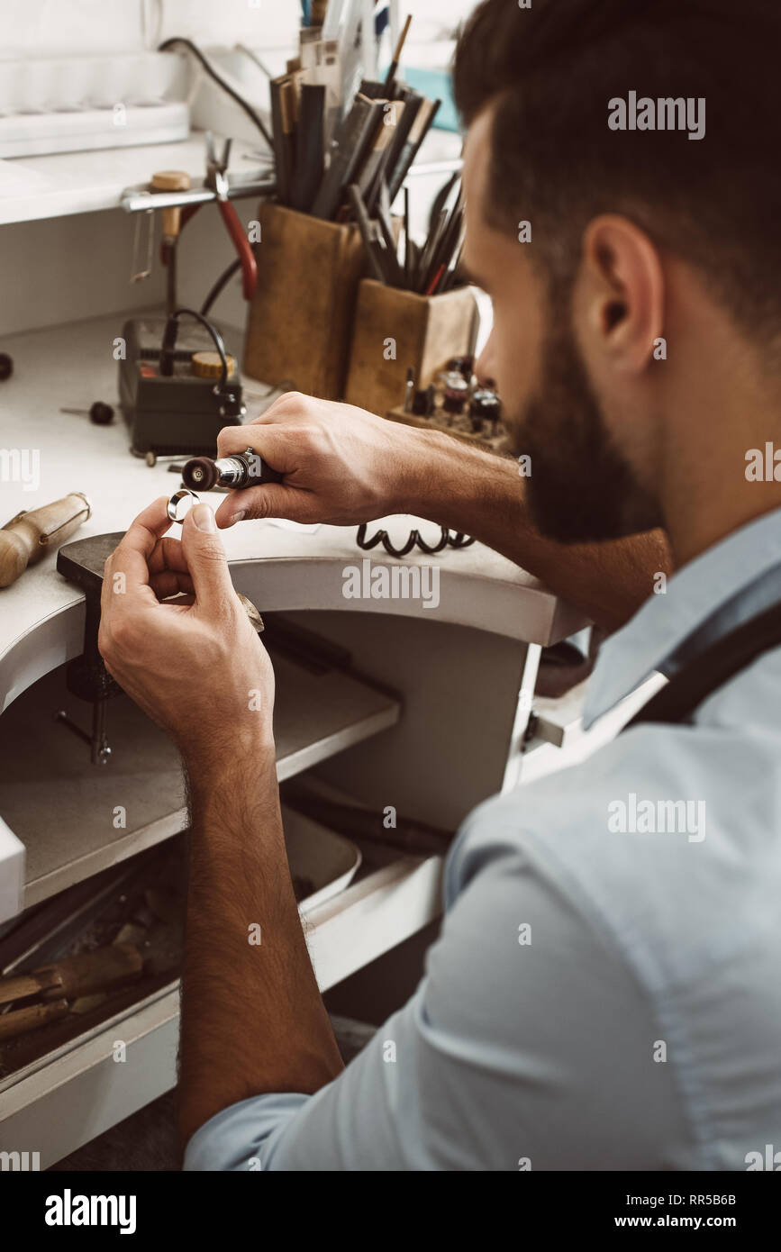 Male jeweler polishing silver hi-res stock photography and images - Alamy