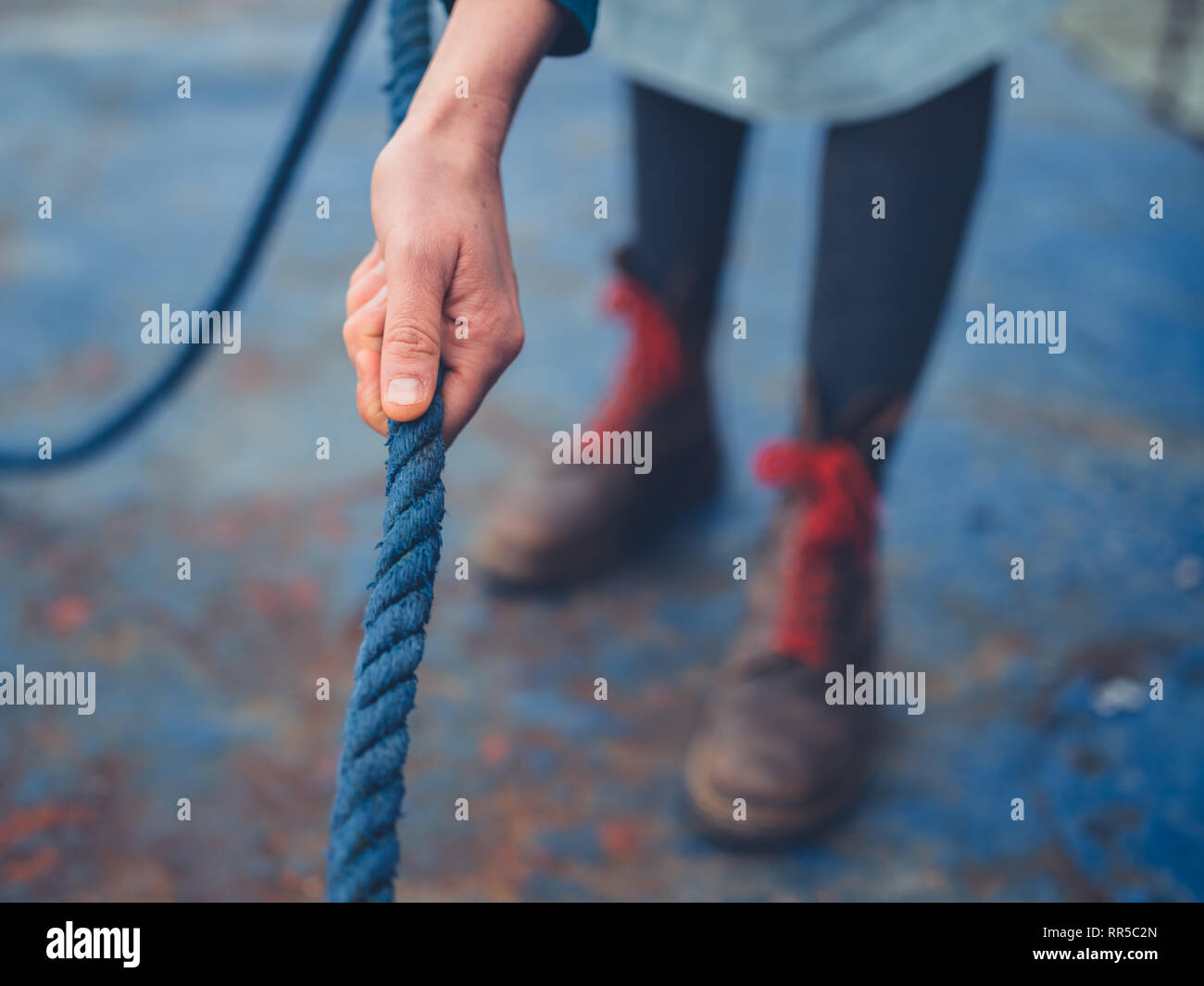 Hands pulling rope hi-res stock photography and images - Alamy