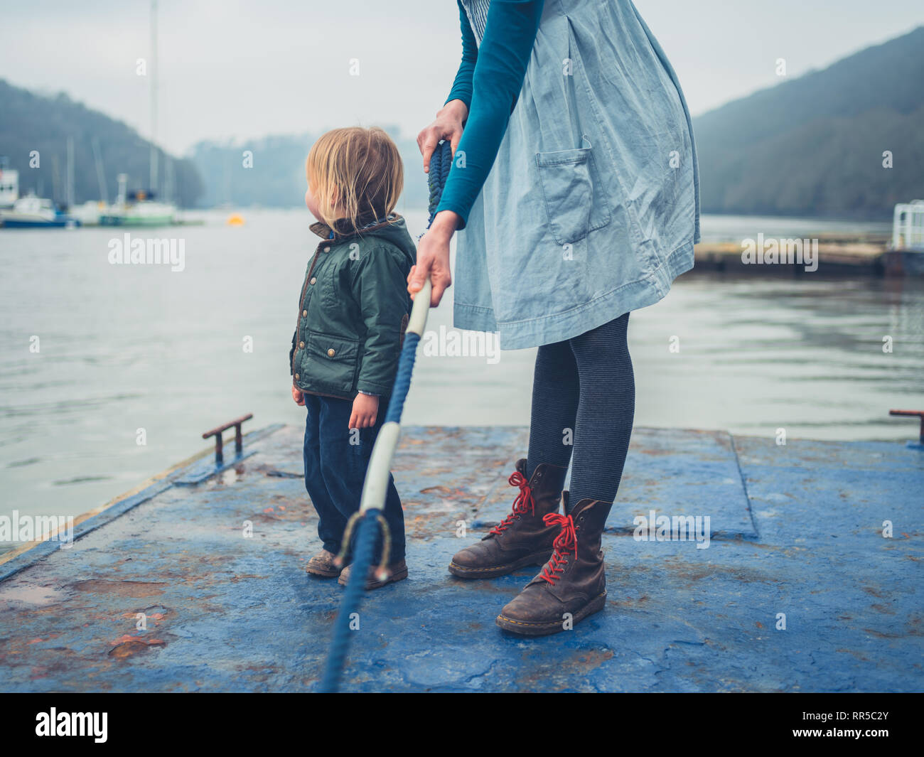 Boy pulling rope hi-res stock photography and images - Alamy
