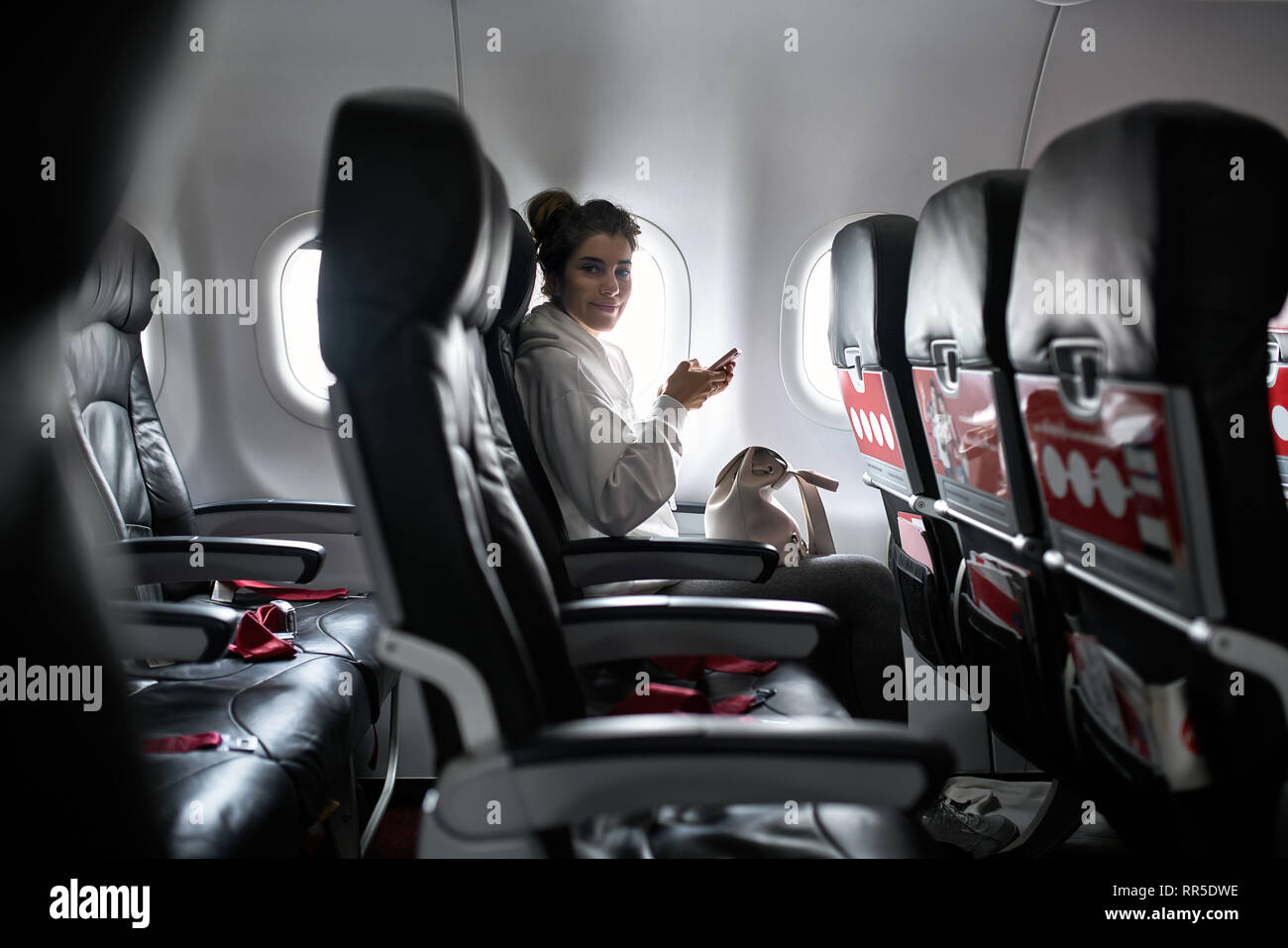 Backpack on seat plane hi-res stock photography and images - Alamy