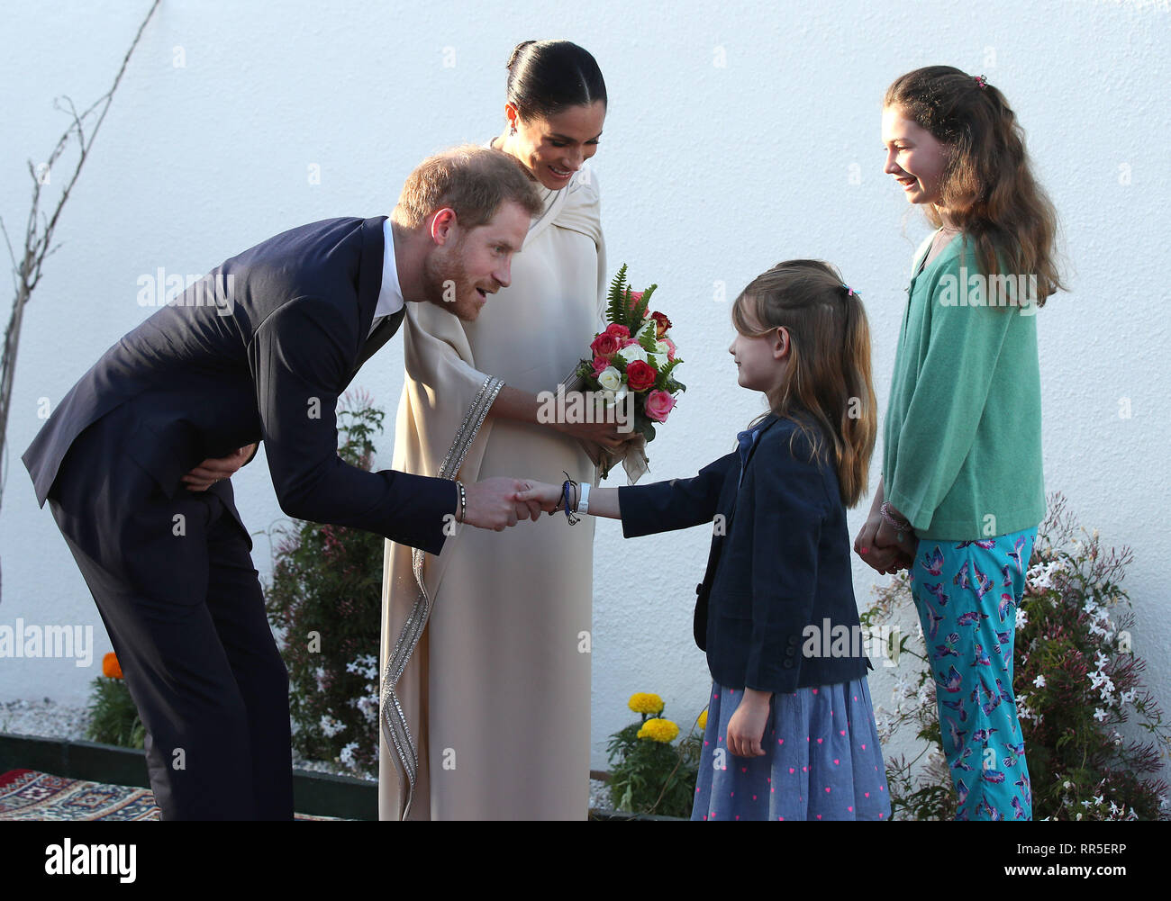 The Duke and Duchess of Sussex are greeted by Orla Reilly aged 12 and ...