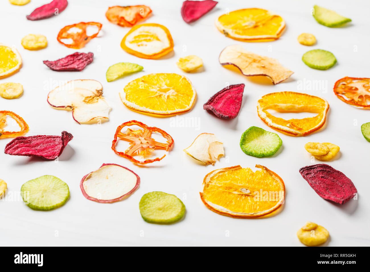 Dried vegetables and fruits on a white background. Plant based food ...