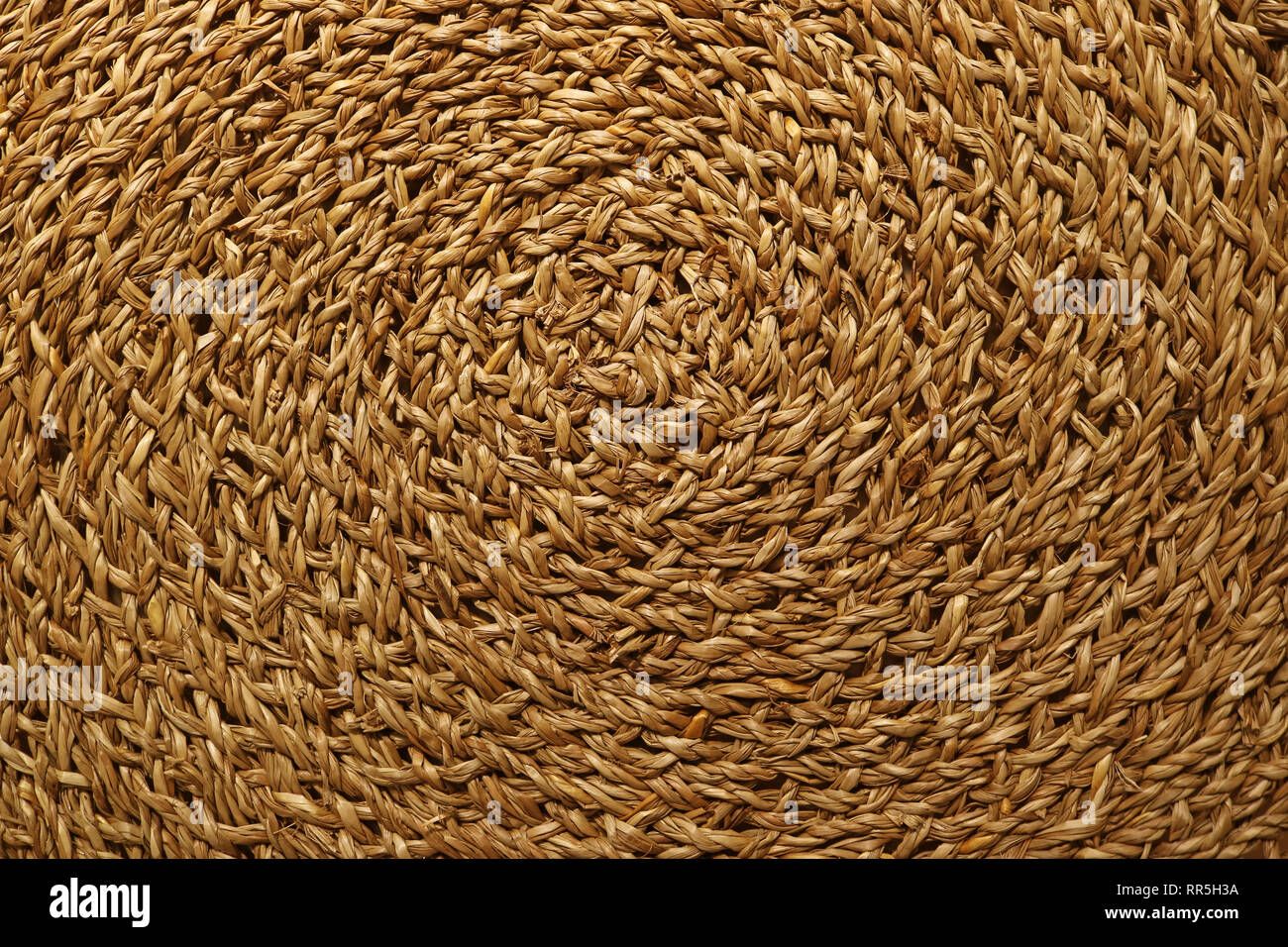 Artistic pattern of golden brown woven sedge place mat surface Stock ...