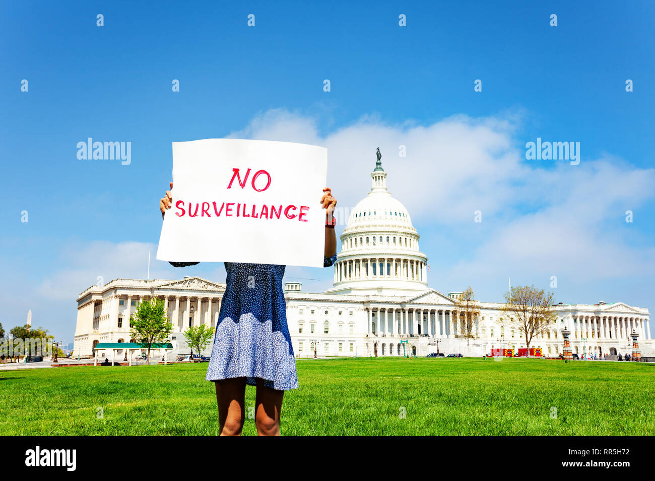 Protester holding in hands sign no surveillance Stock Photo - Alamy