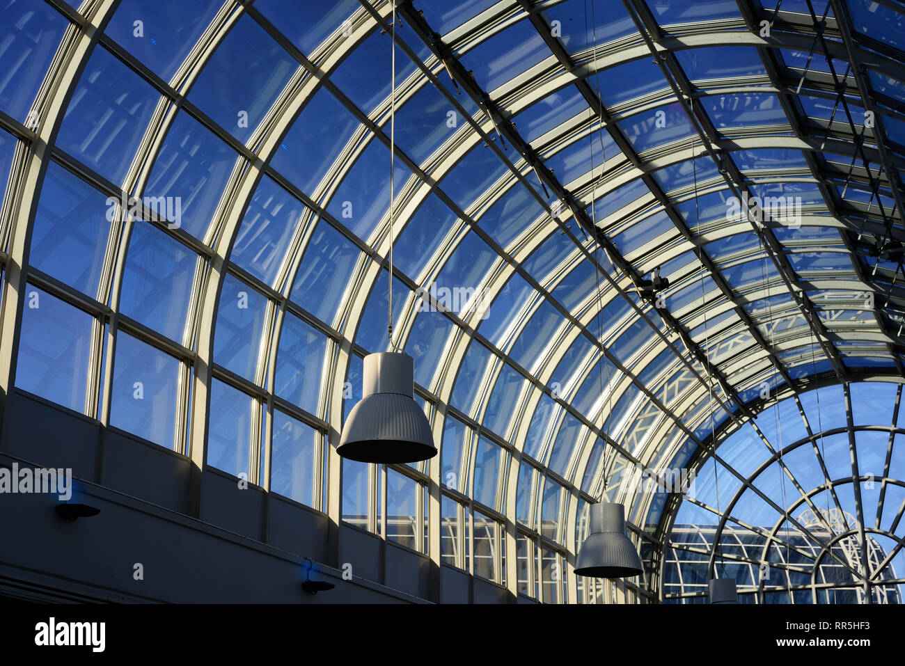 modern glass arched roof, lamp, blue sky Stock Photo - Alamy