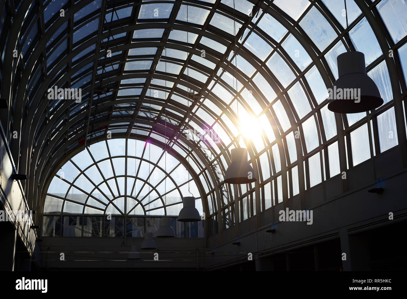 modern glass arched roof, lamp, blue sky Stock Photo - Alamy