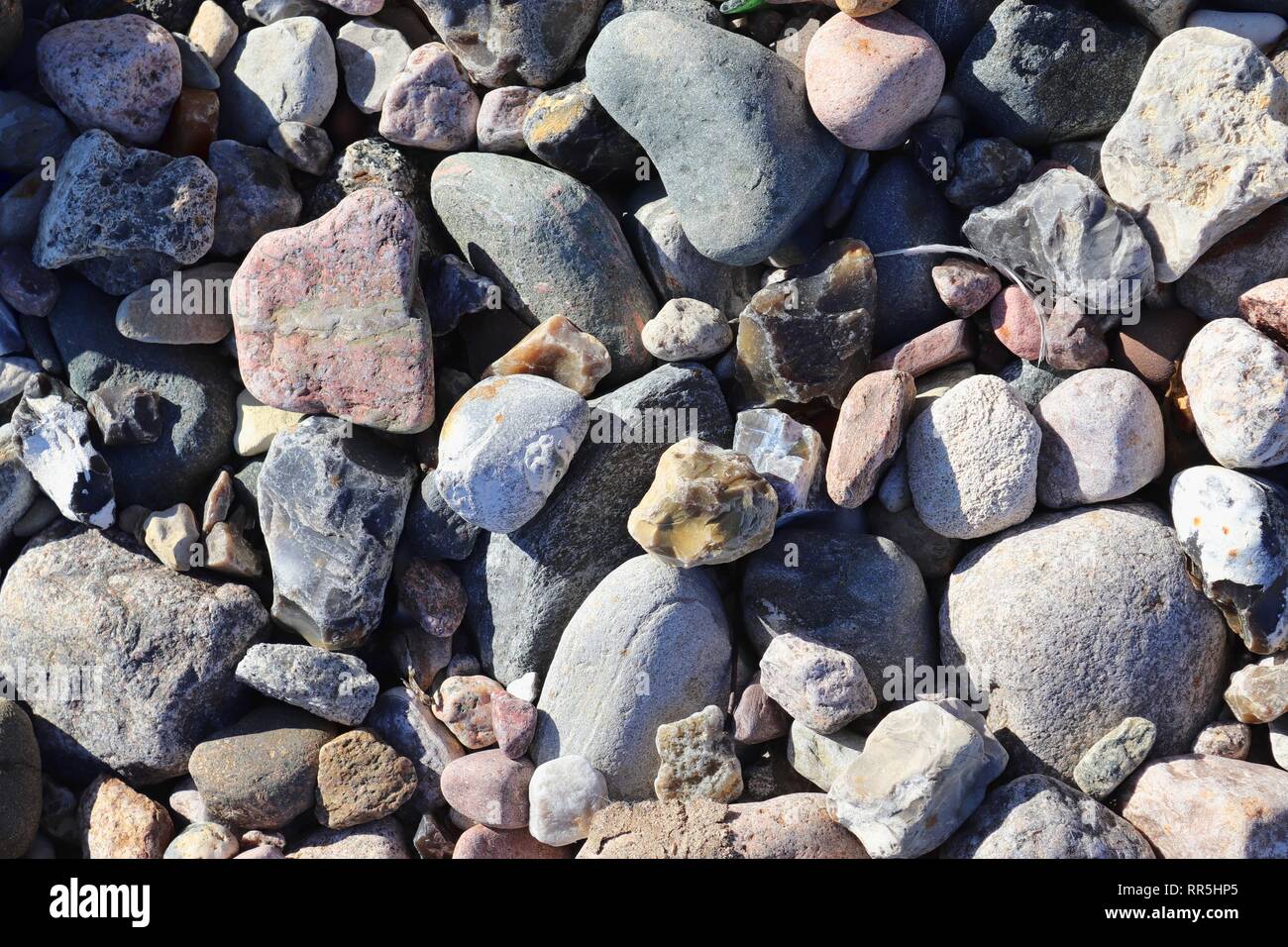 Beuatiful stone pebbles at the beach of the baltic sea in the north of ...