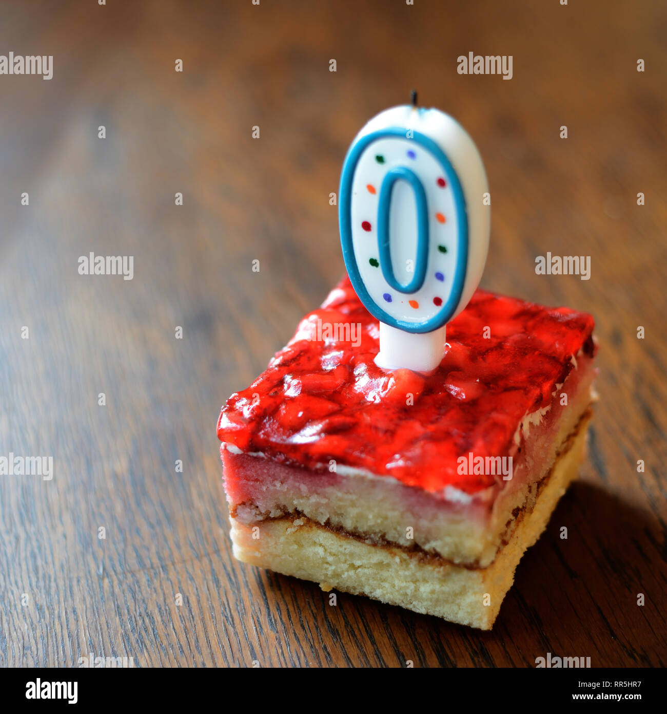 birthday cake with zero shaped candle on wooden background Stock Photo ...