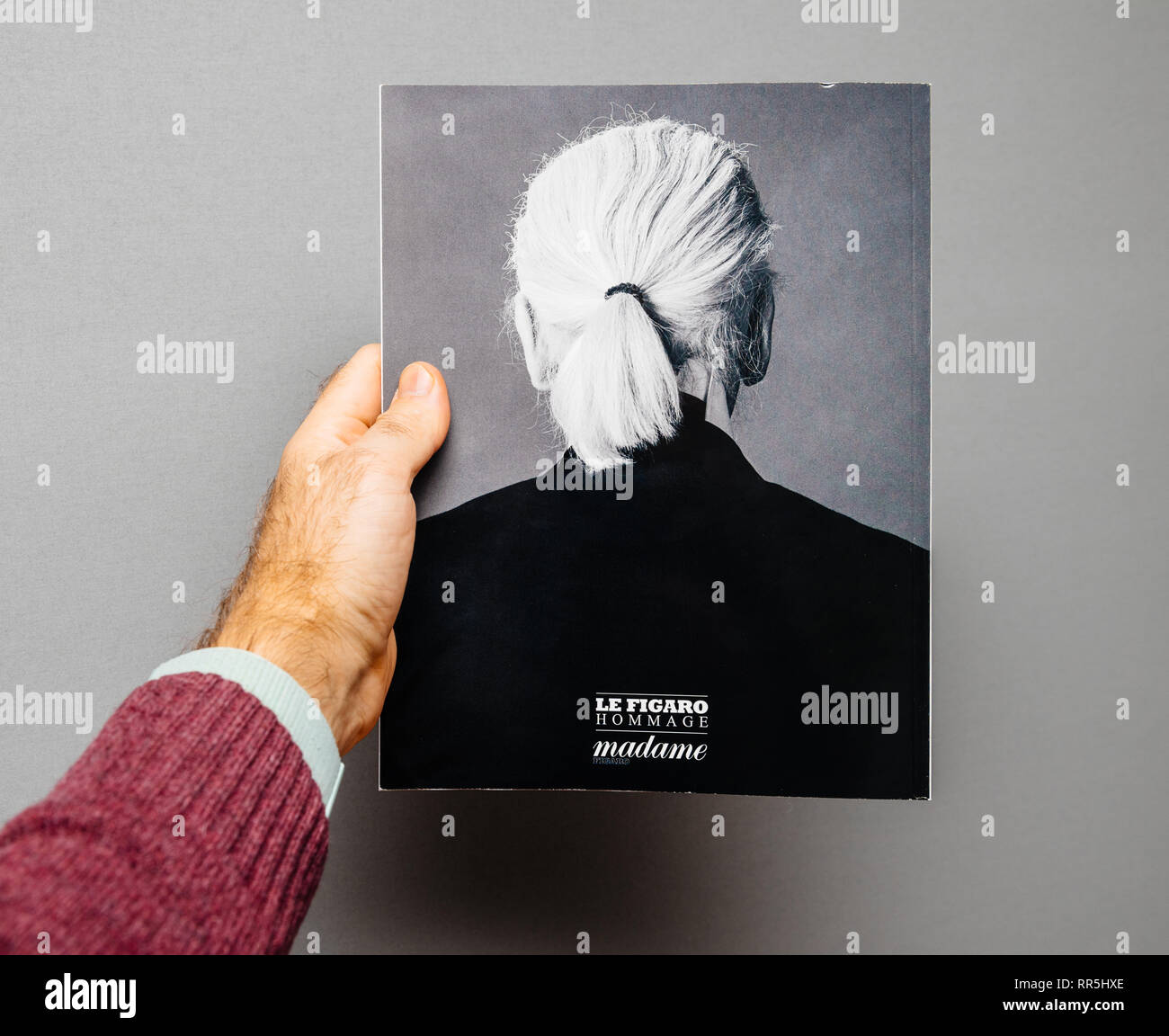 Paris, France - Feb 23, 2019: Man showing French Le Figaro hommage ...