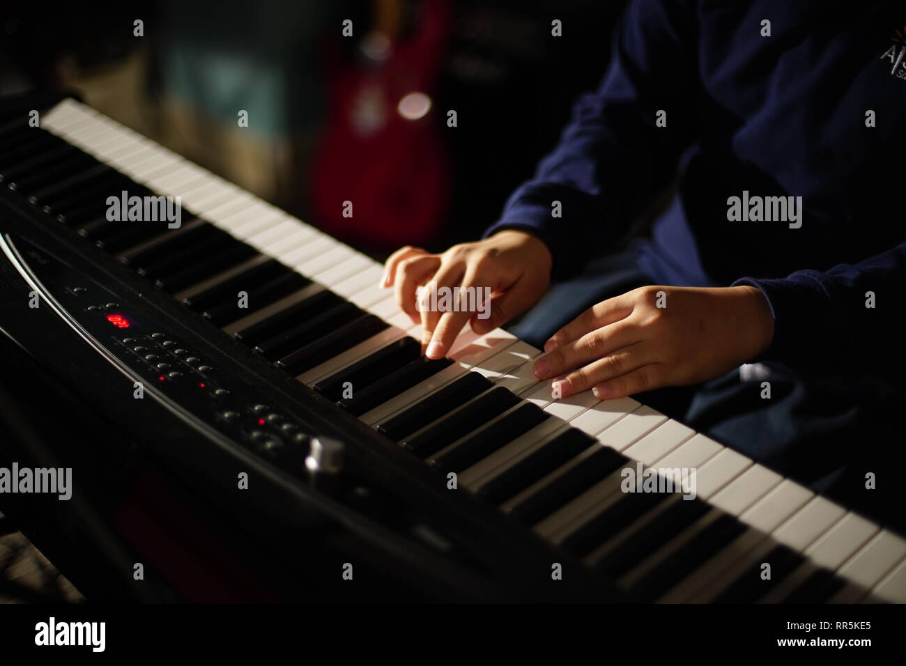 Young children playing musical instruments hi-res stock photography and ...