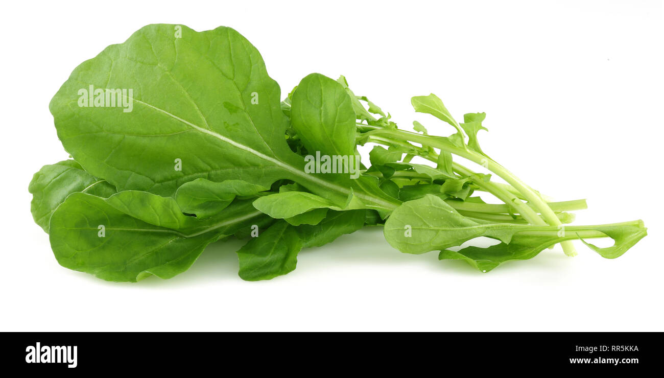 Bunch of fresh rucola isolated on white background Stock Photo - Alamy