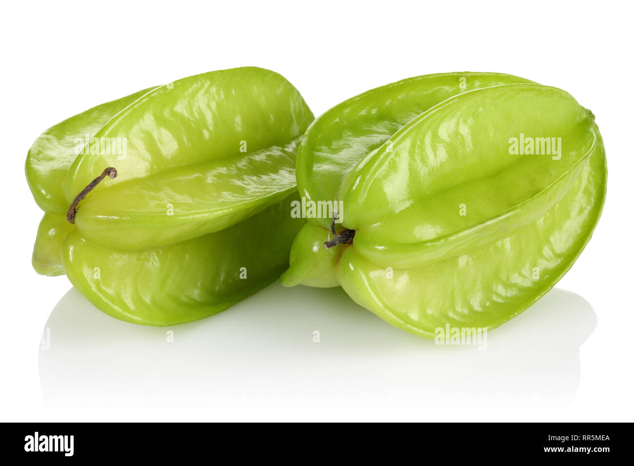 Fresh whole Star fruits isolated on white background Stock Photo - Alamy