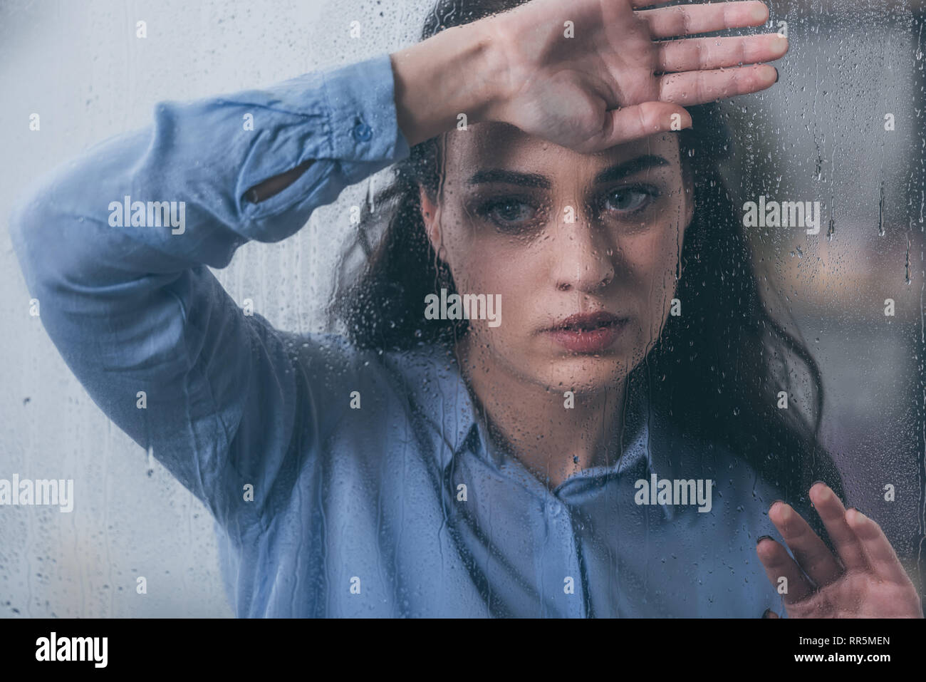 Woman broken window hi-res stock photography and images - Alamy