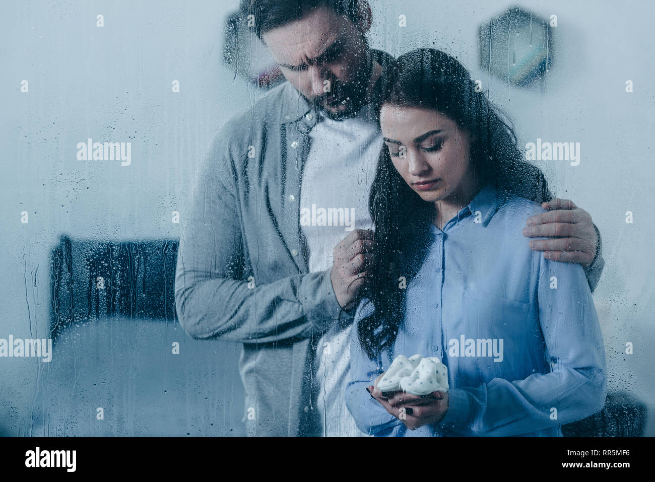 Grief mourning hugging hi-res stock photography and images - Alamy