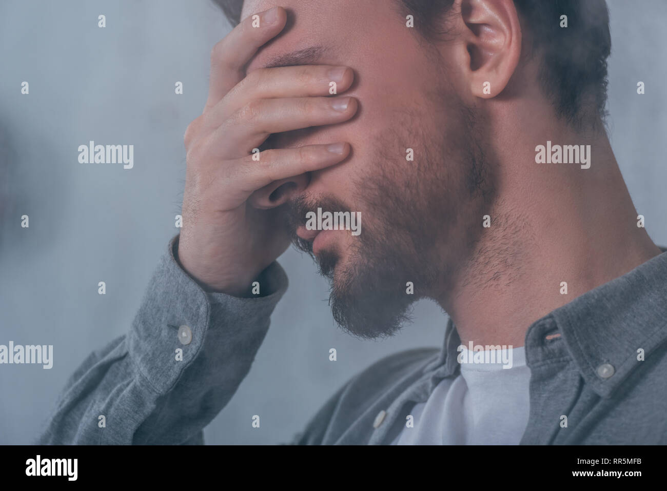 adult man covering face with hands and crying Stock Photo - Alamy