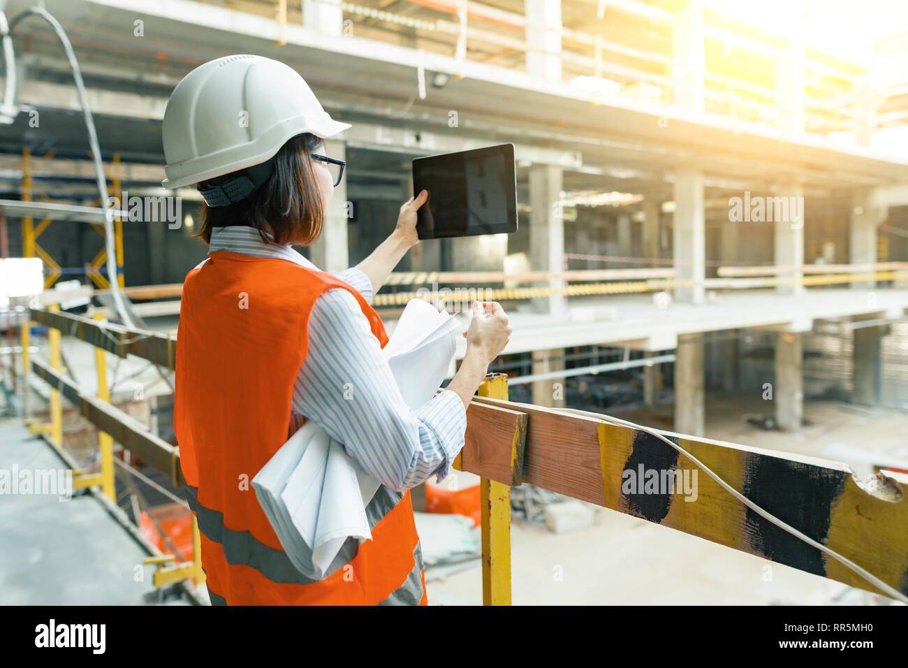 Portrait of adult female builder, engineer, architect, inspector ...