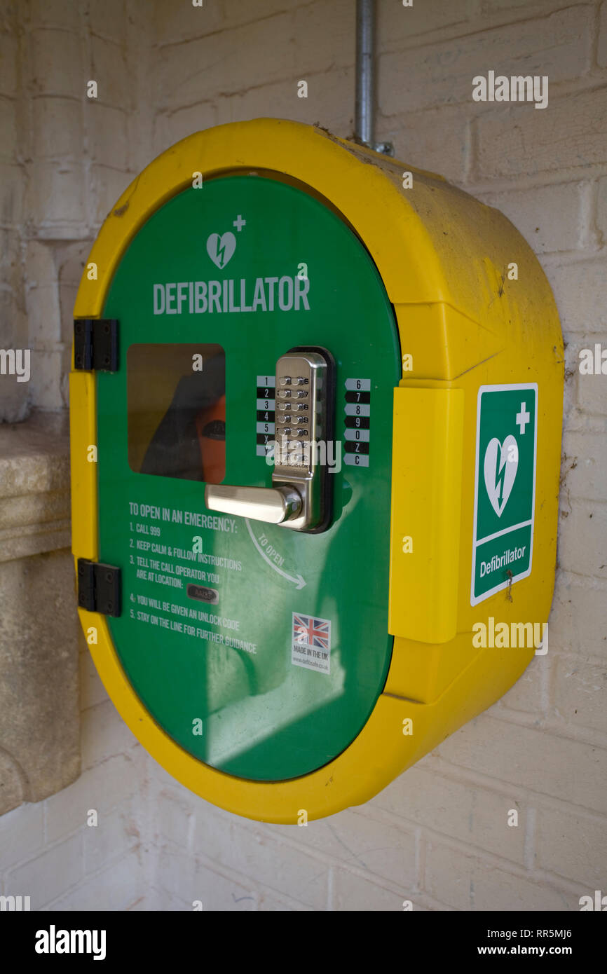 Public access defibrillator with emergency keypad lock on wall Stock ...