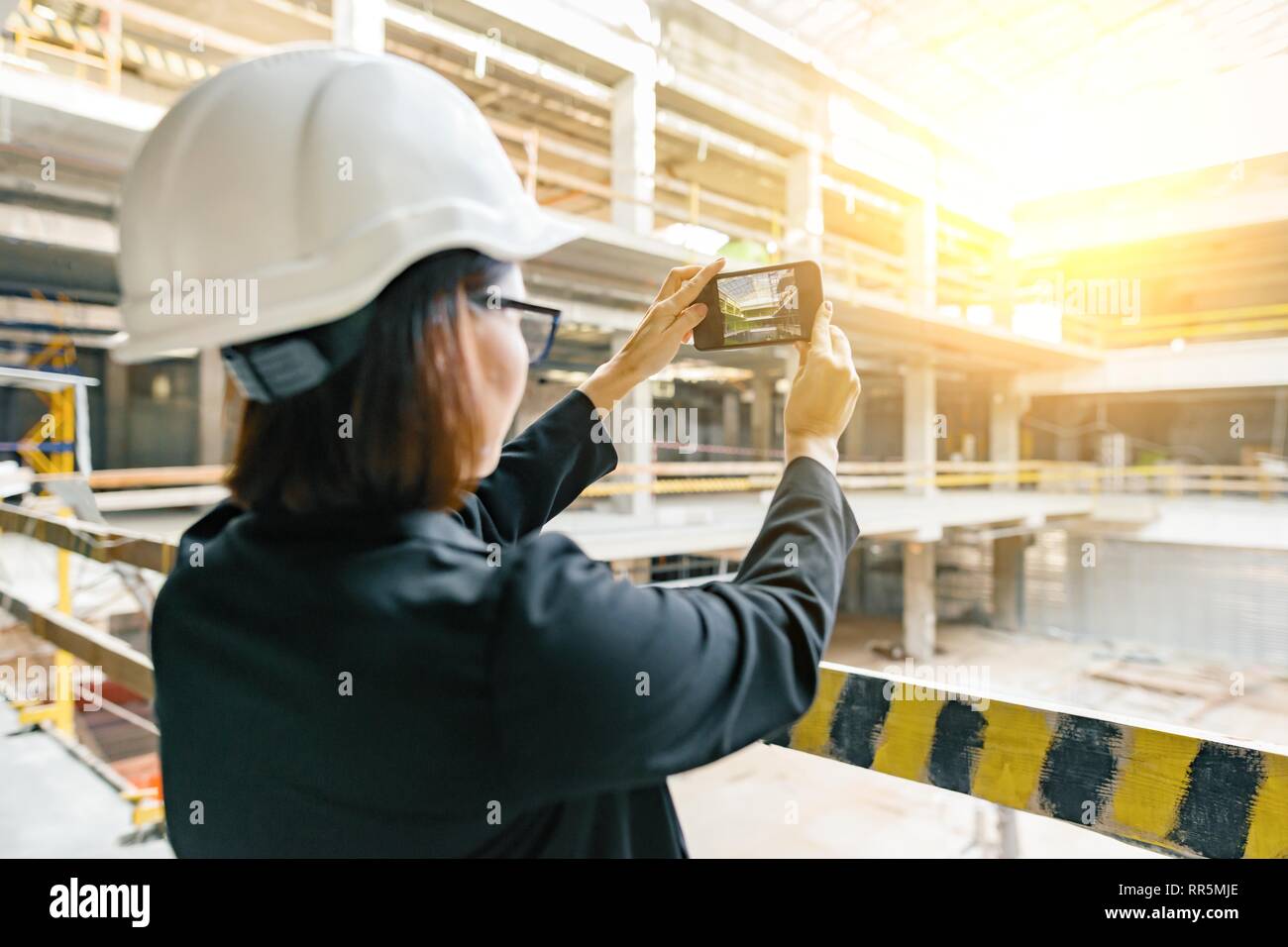 Portrait of adult female builder, engineer, architect, inspector ...