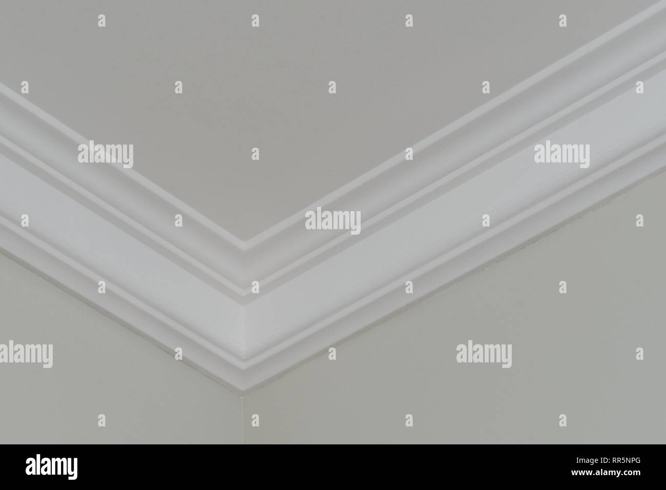 Ceiling moldings in the interior, a detail of corner Stock Photo - Alamy