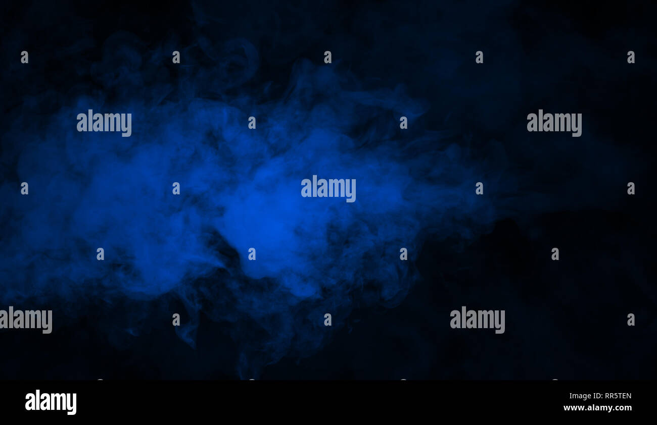 Abstract blue smoke mist fog on a black background. Texture background ...