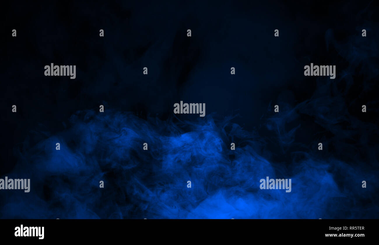 Abstract blue smoke mist fog on a black background. Texture background ...