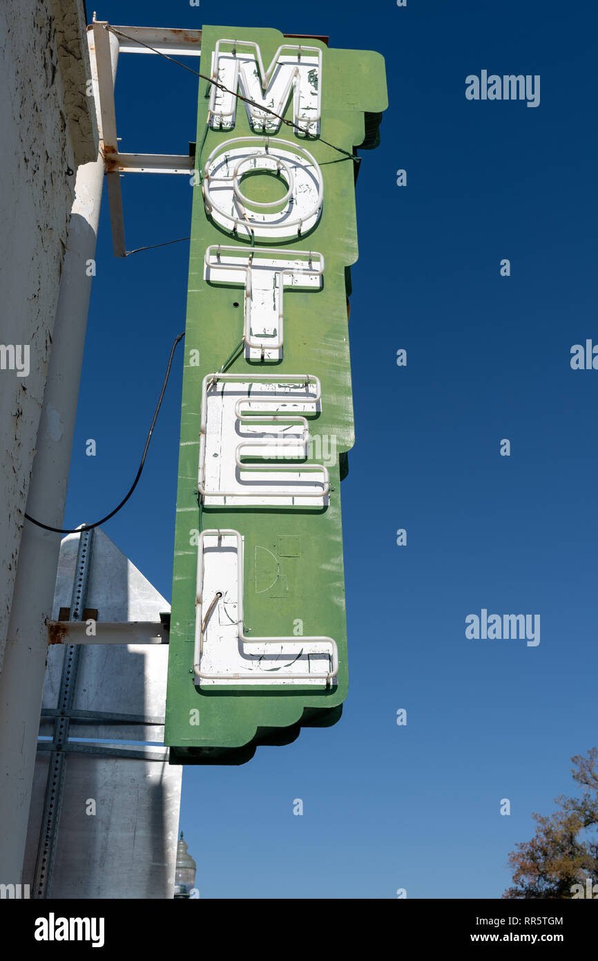 Green neon motel sign in daylight Stock Photo - Alamy