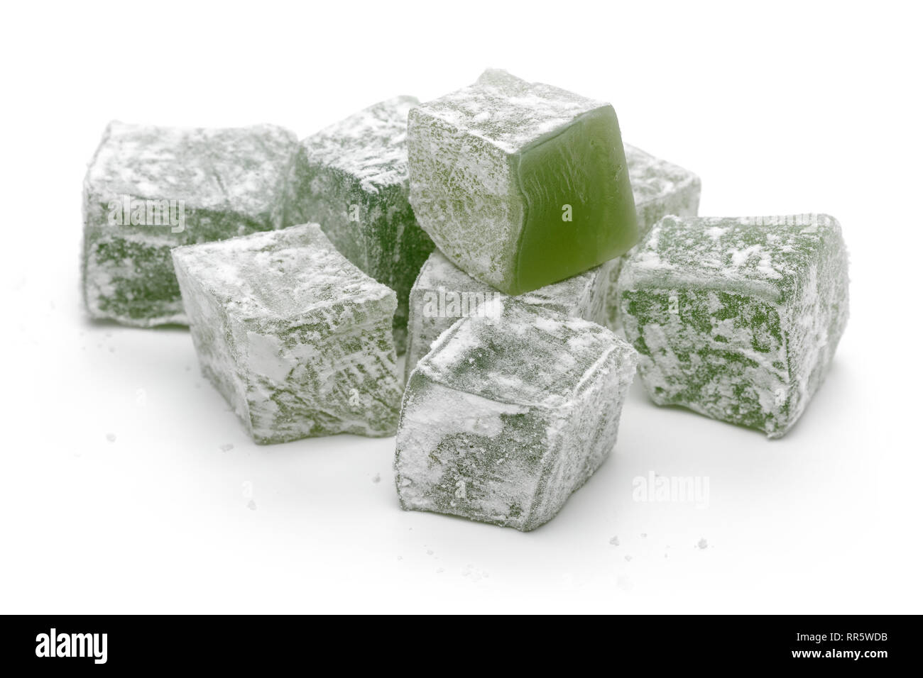 Green Turkish delights isolated on white background Stock Photo - Alamy