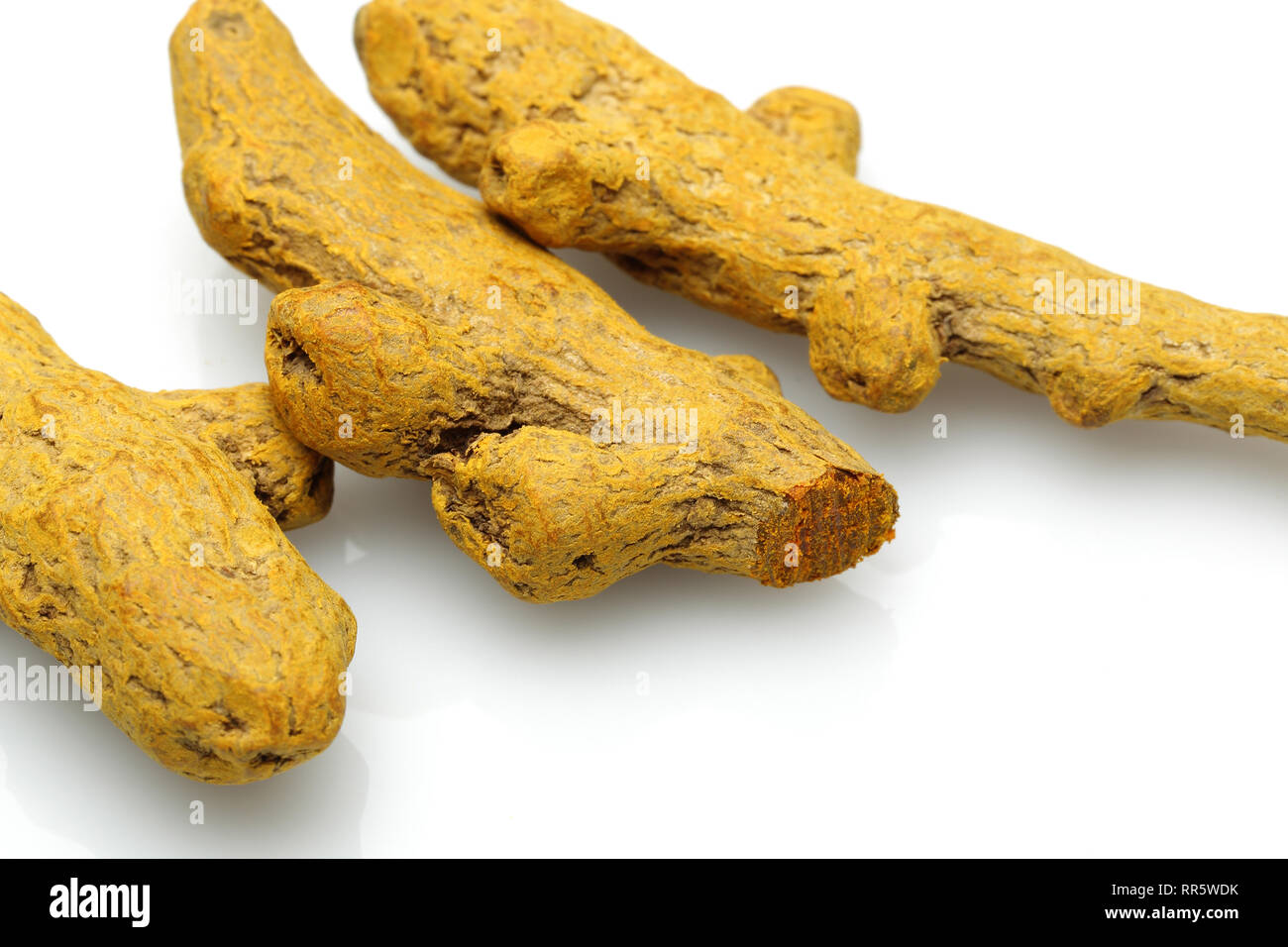 Dried turmeric isolated on white background Stock Photo - Alamy