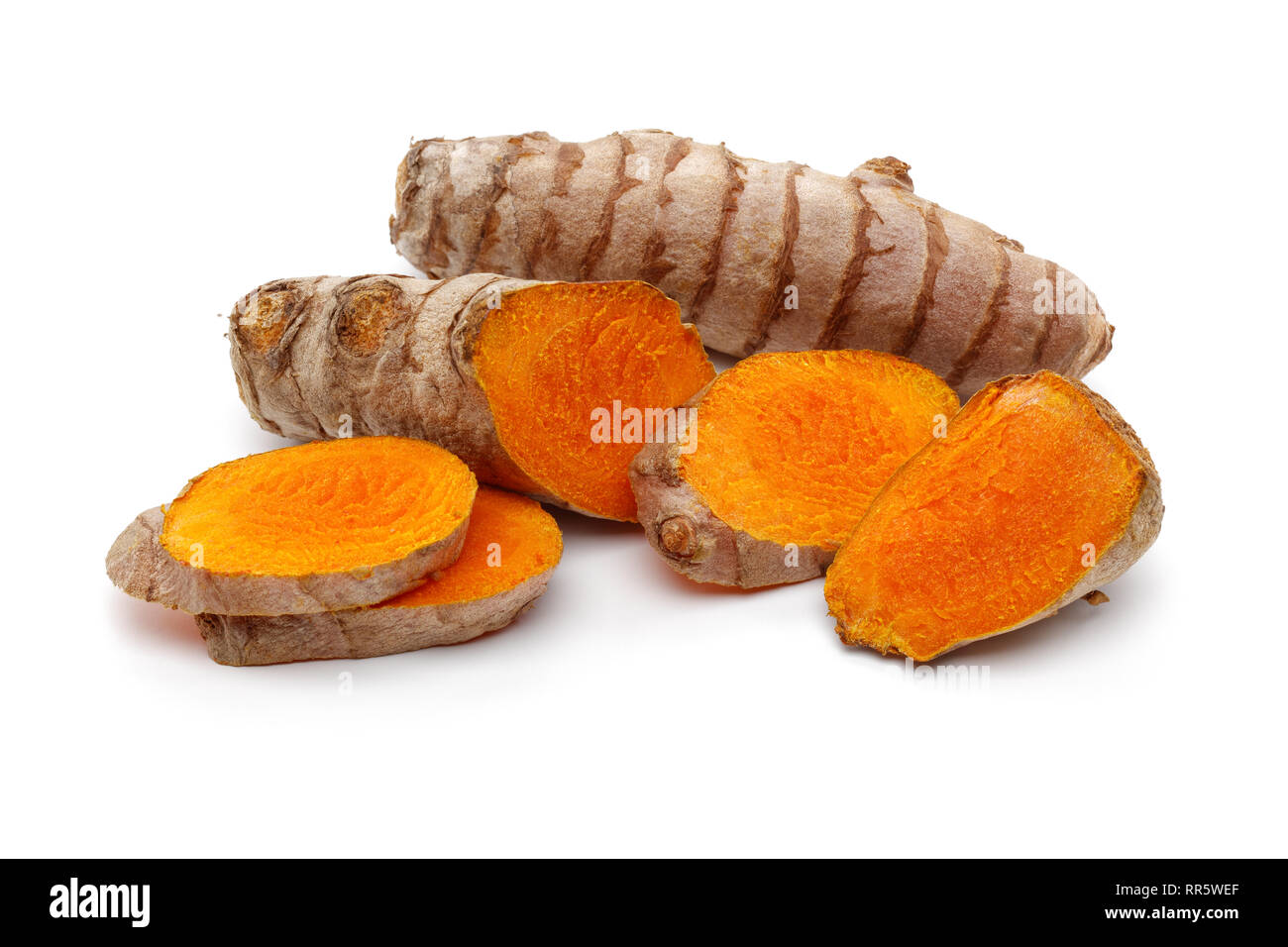 Fresh turmeric and slices isolated on white background Stock Photo - Alamy