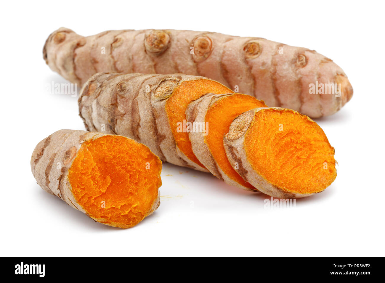 Fresh turmeric and slices isolated on white background Stock Photo - Alamy