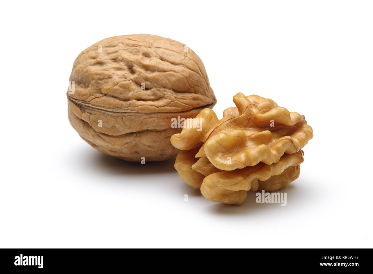 Walnuts and cracked walnut isolated on white background Stock Photo - Alamy