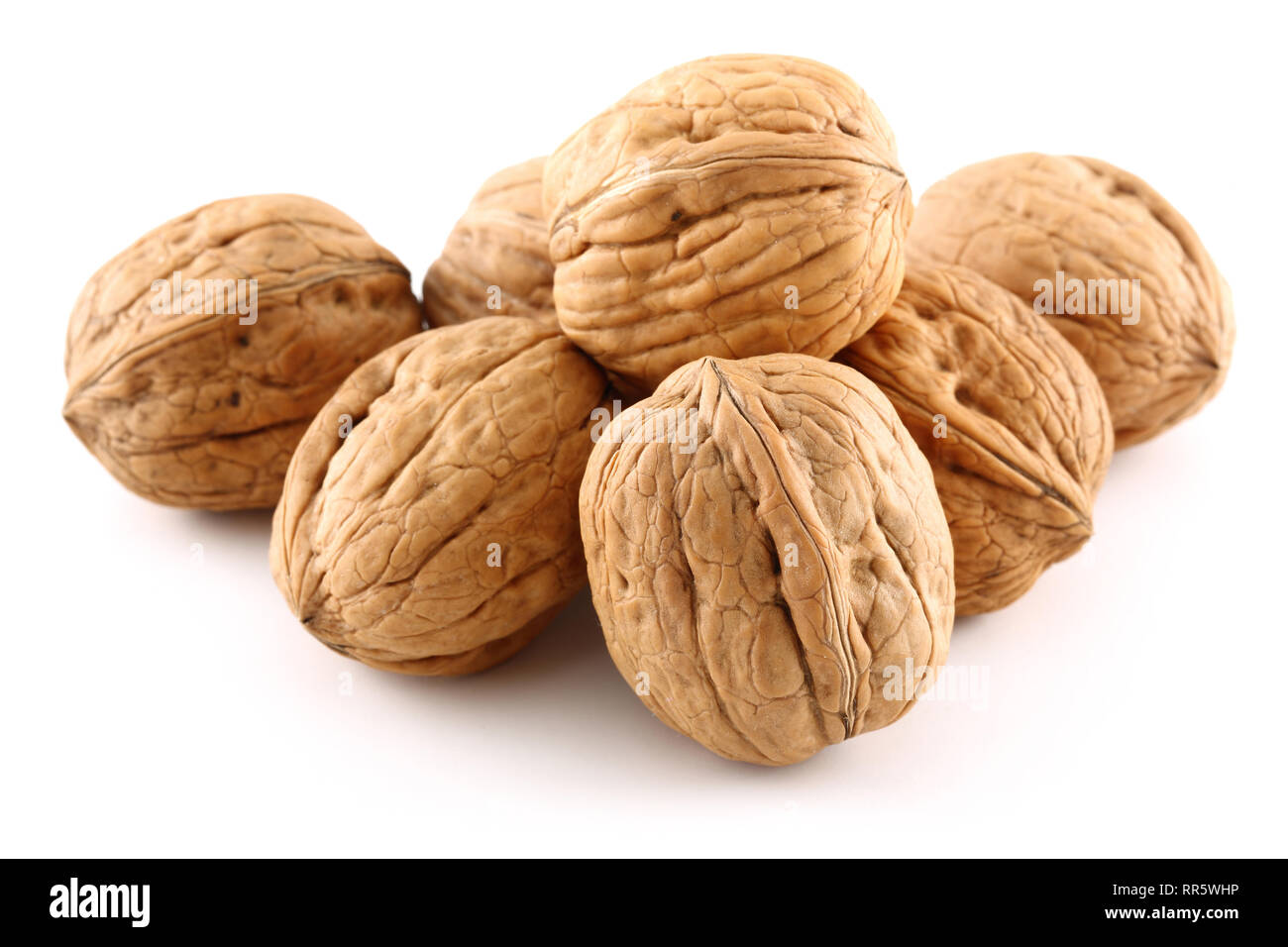 Group of whole walnuts isolated on white background Stock Photo - Alamy
