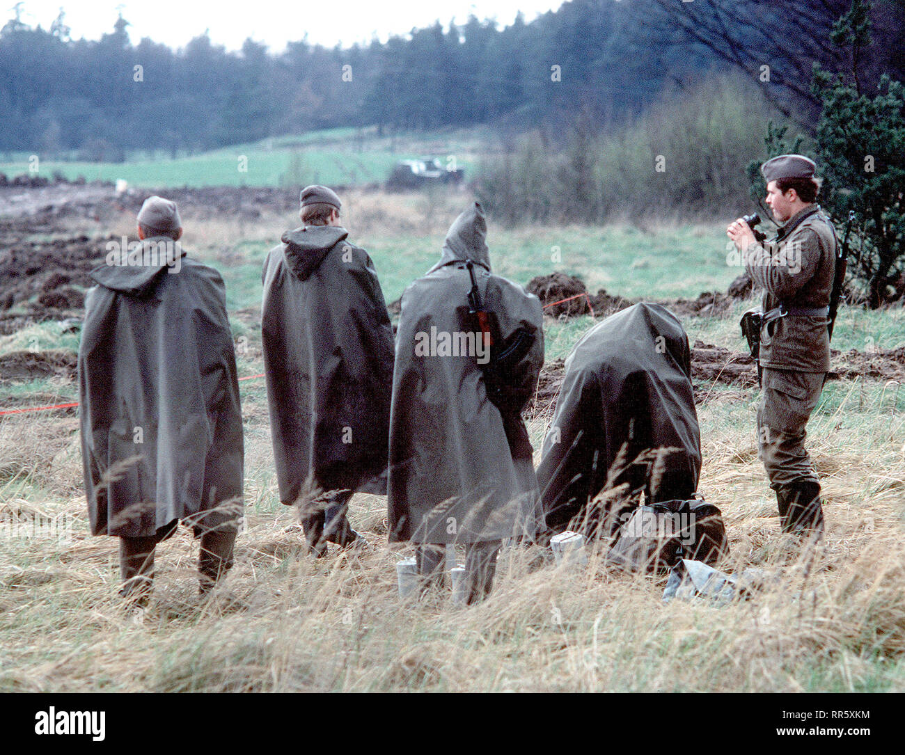 1979 - East German soldiers on guard at the border between East and ...