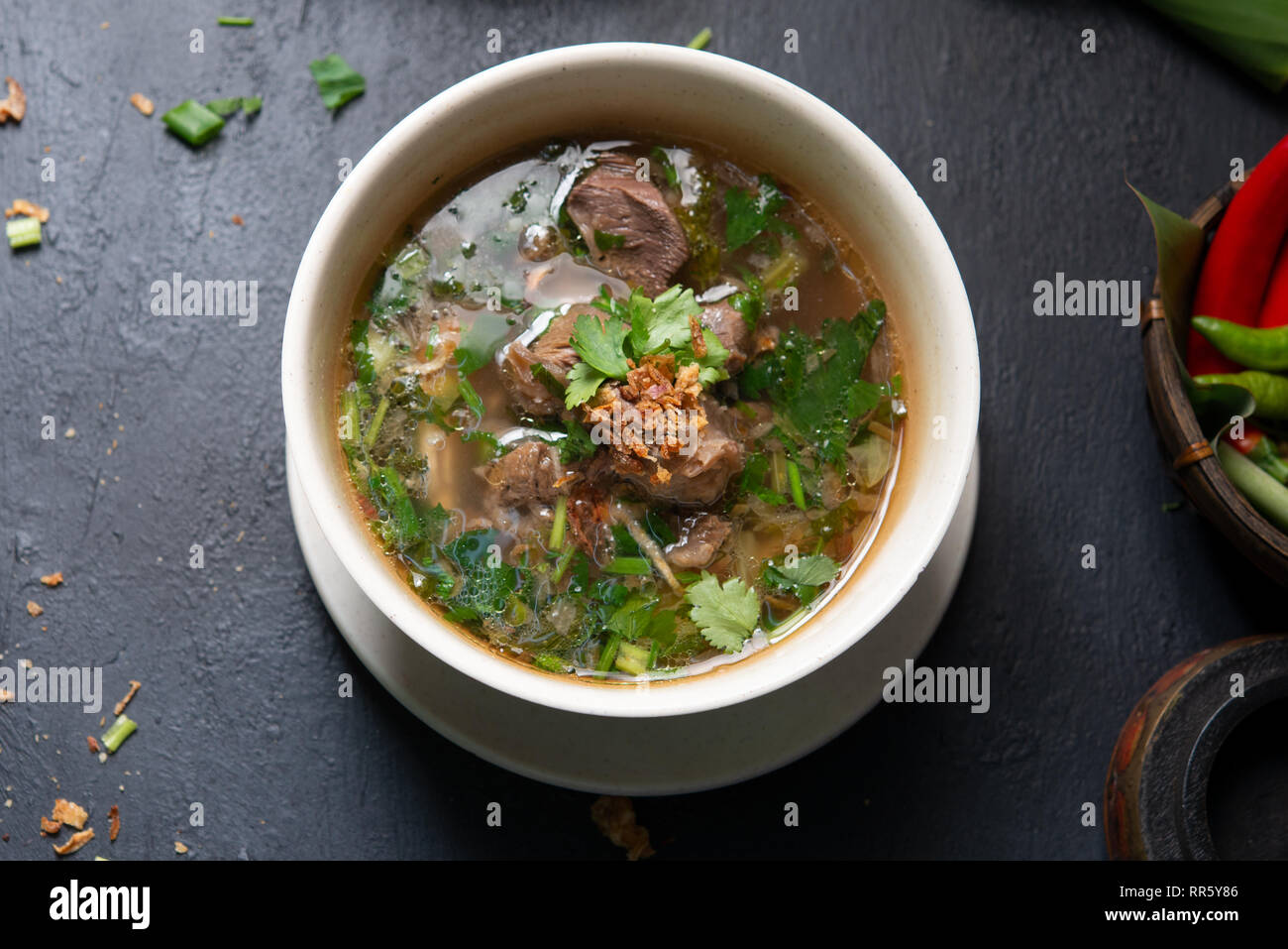 Asian bone soup or sup tulang, popular traditional malay dish. Top view ...