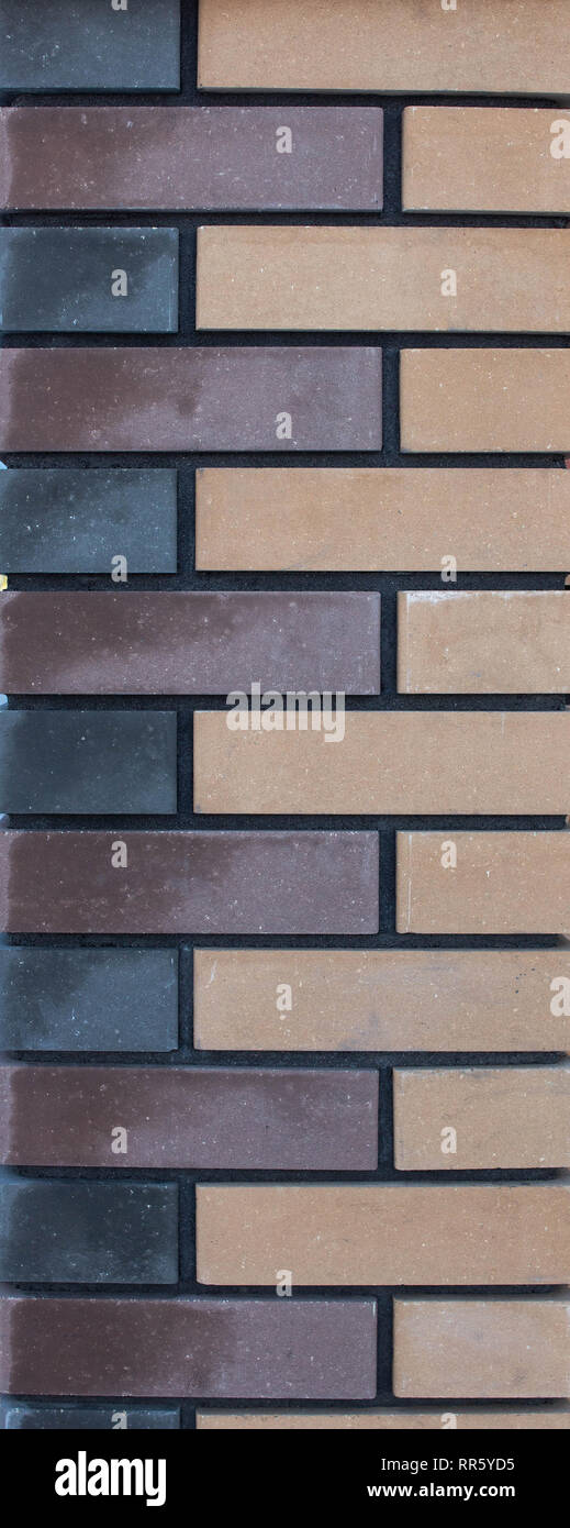 Modern brick column with brown and gray bricks, designer, texture ...