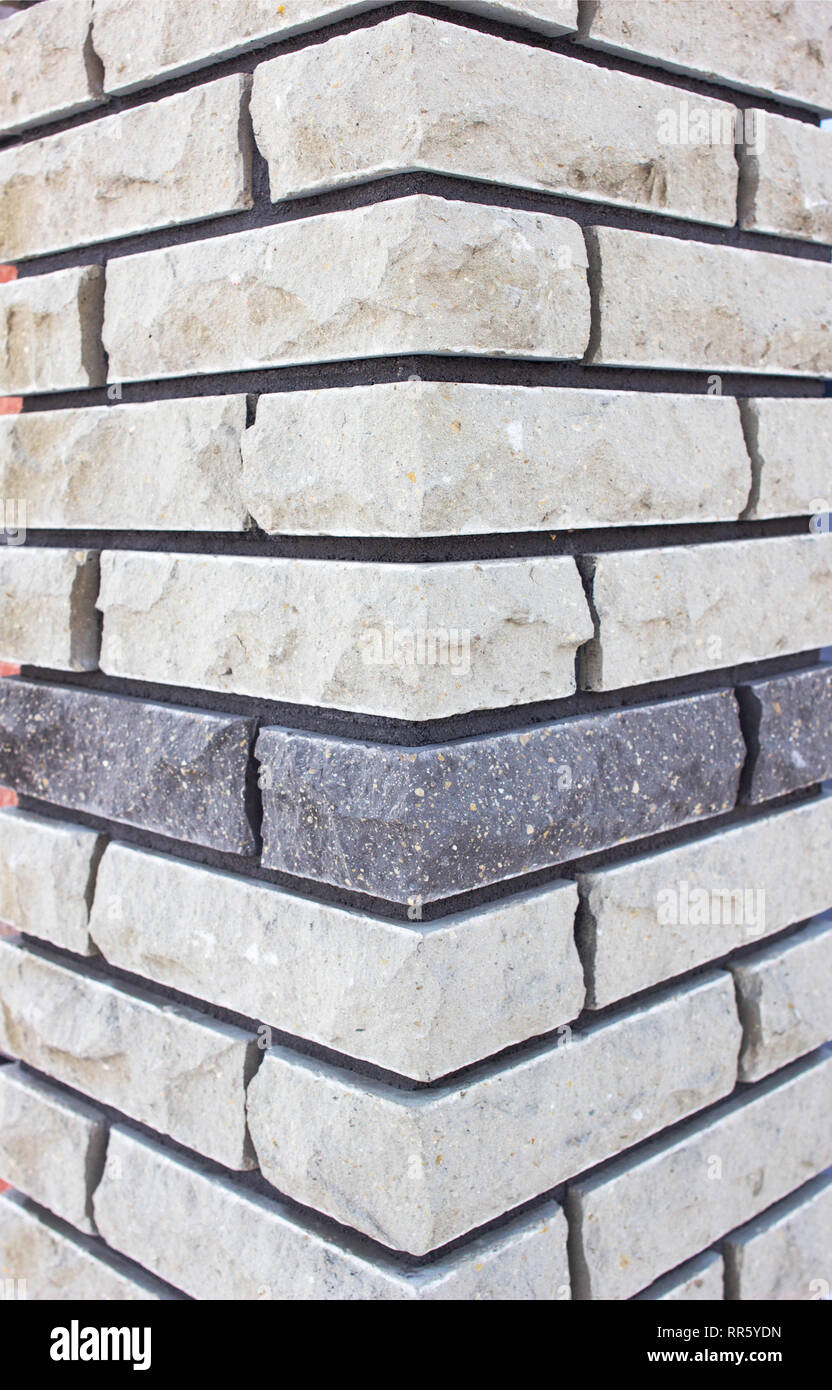 Modern brick column with brown and gray bricks, designer, texture ...