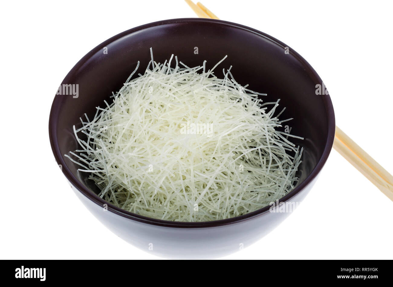 Thin dry rice noodles for cooking Asian dishes. Studio Photo Stock ...