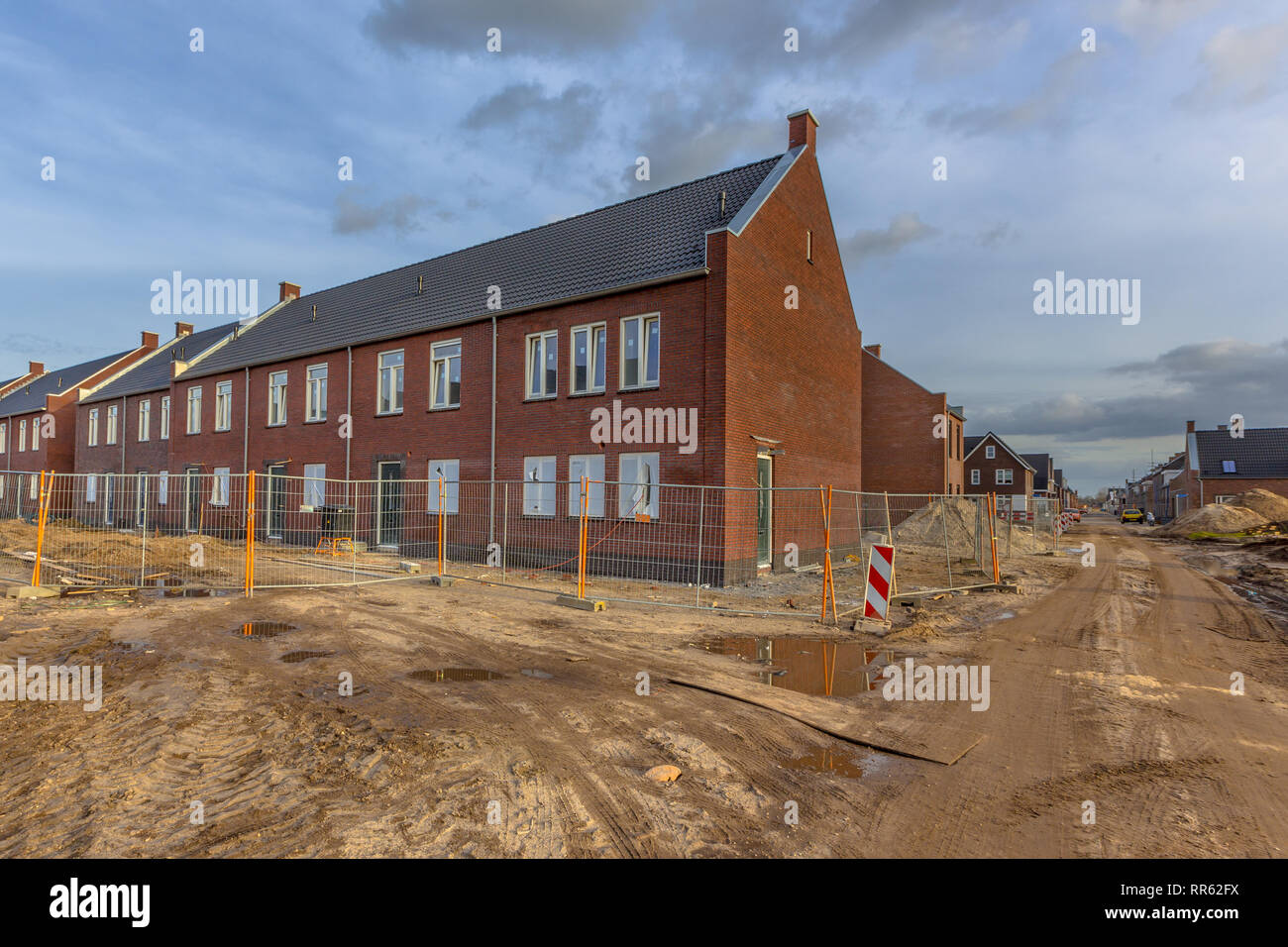 Newly built houses in modern street building site in suburb of city in ...