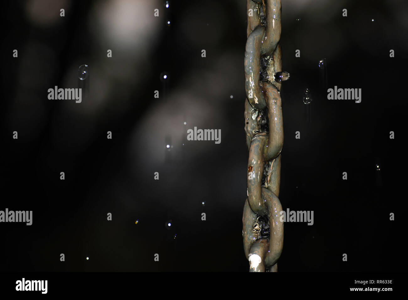 Water Dripping And Flowing Down Chain Links Stock Photo - Alamy
