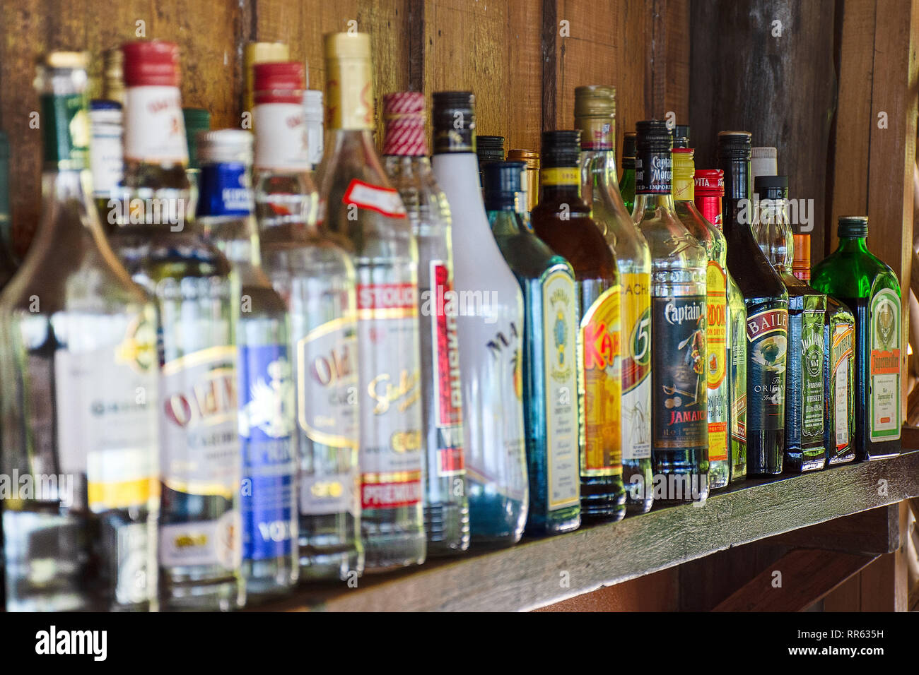 Rows of large selection of bottle spirits on bar shelf Stock Photo - Alamy