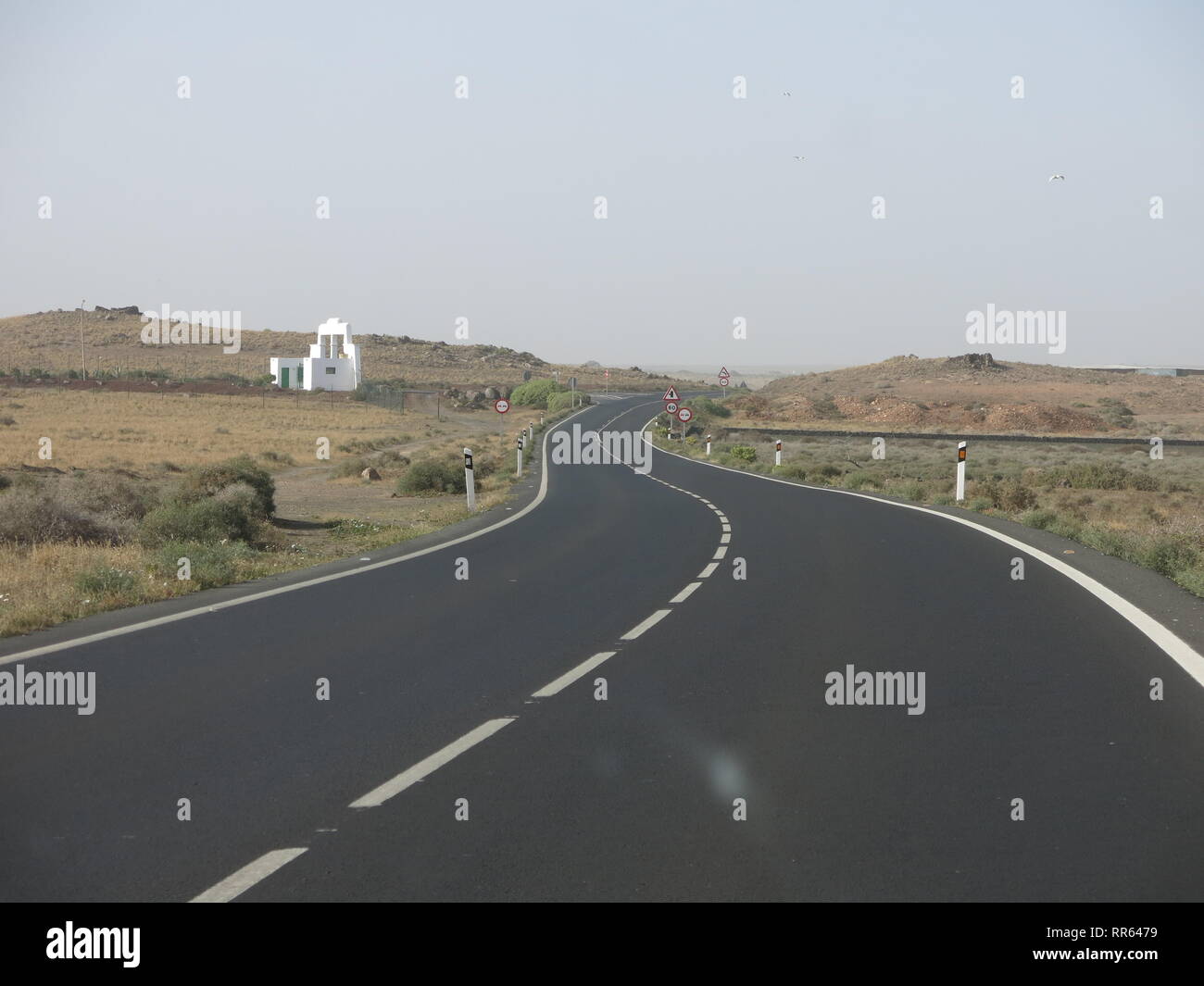 Modern tarmacked roads wind through the bleak and rugged volcanic ...