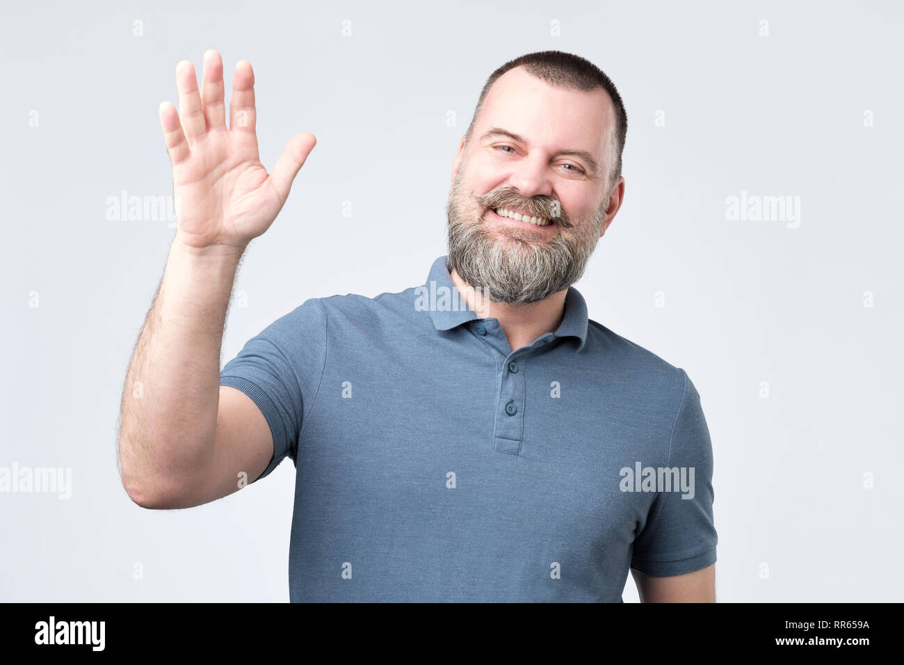 Man waving goodbye hi-res stock photography and images - Alamy