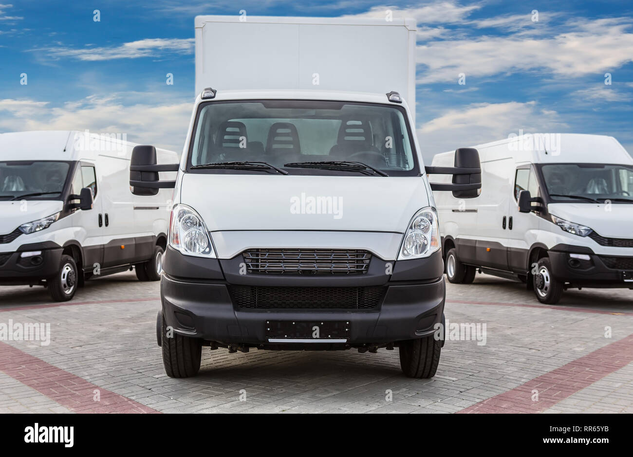 Transport truck and minivans cargo delivery Stock Photo - Alamy