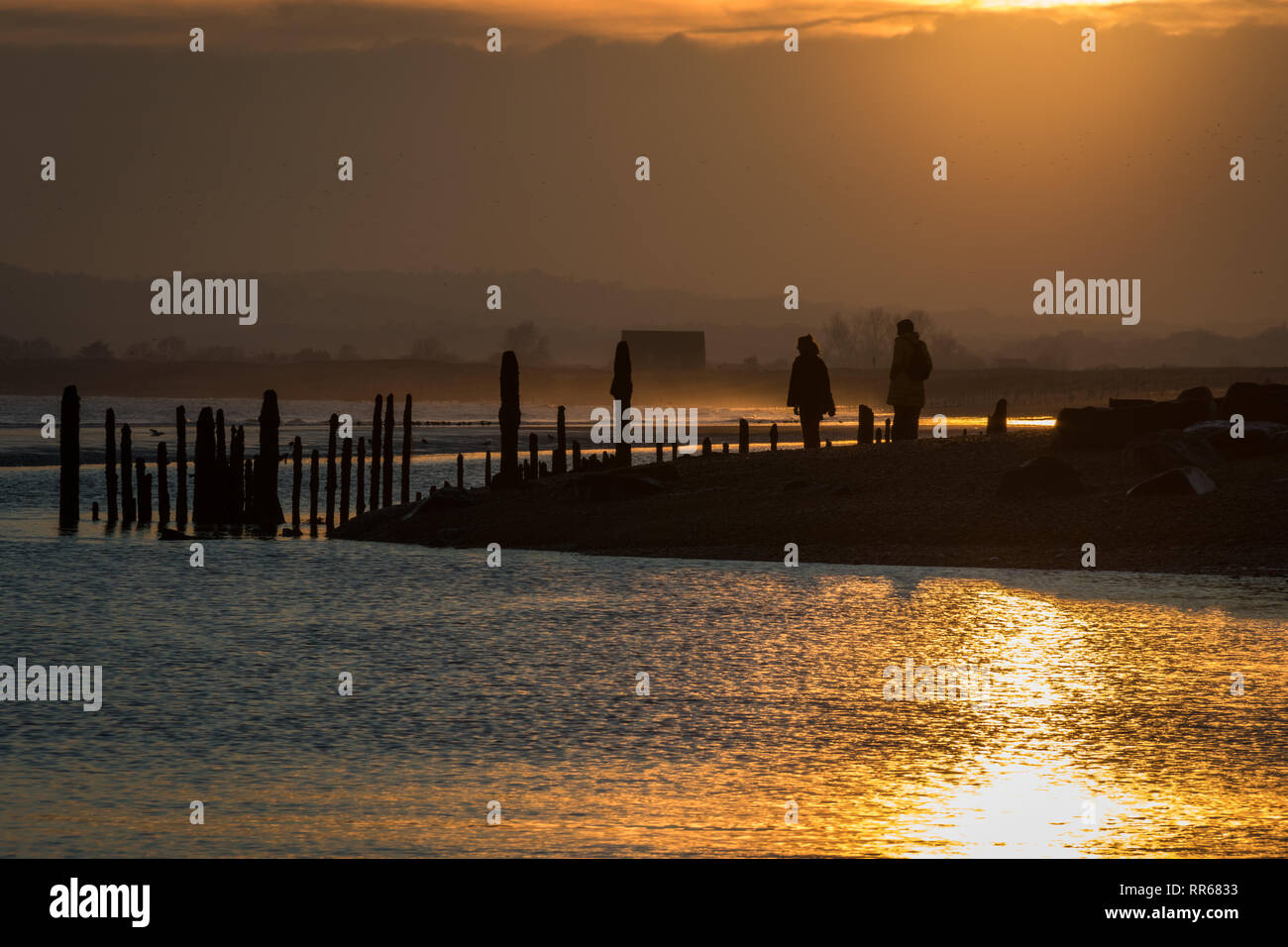 Silhouettes at sunset at Rye Harbour Stock Photo - Alamy