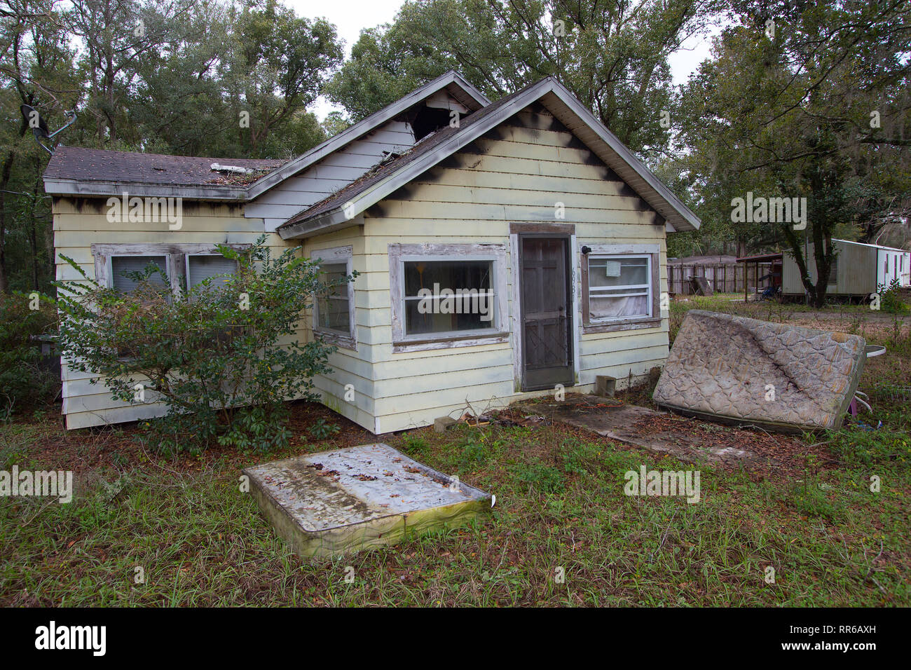Fire damaged abandoned house Stock Photo - Alamy