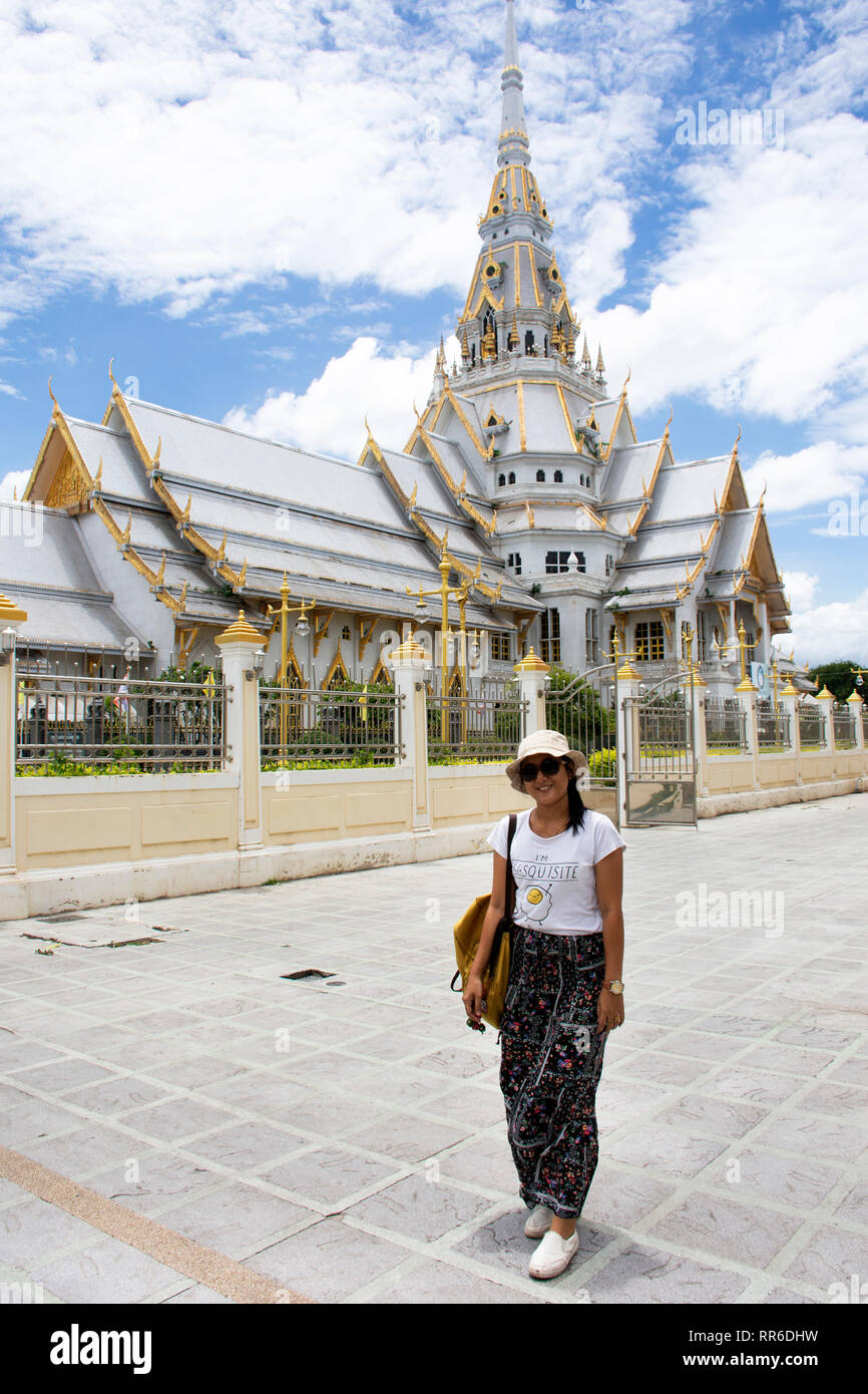 Thai woman standing posing for take photo with Ubosot of Wat Sothon ...