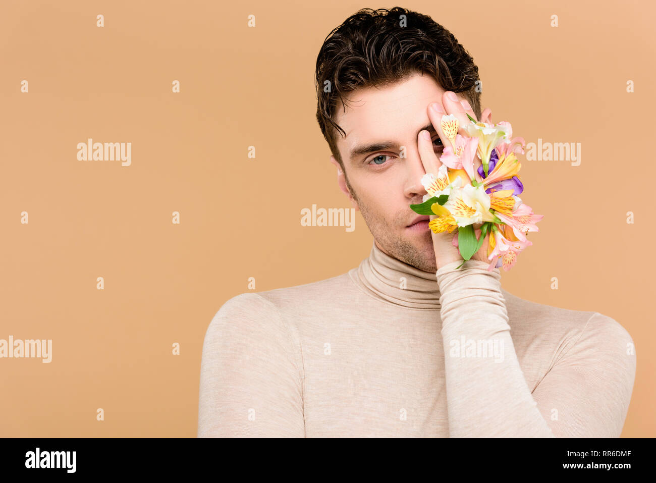 Portrait man covering one eye hi-res stock photography and images - Alamy