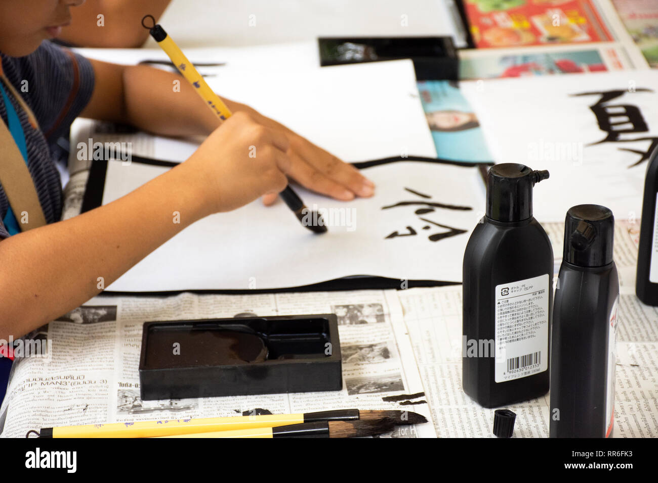 Travelers people join with use paintbrush writing japanese activity in ...