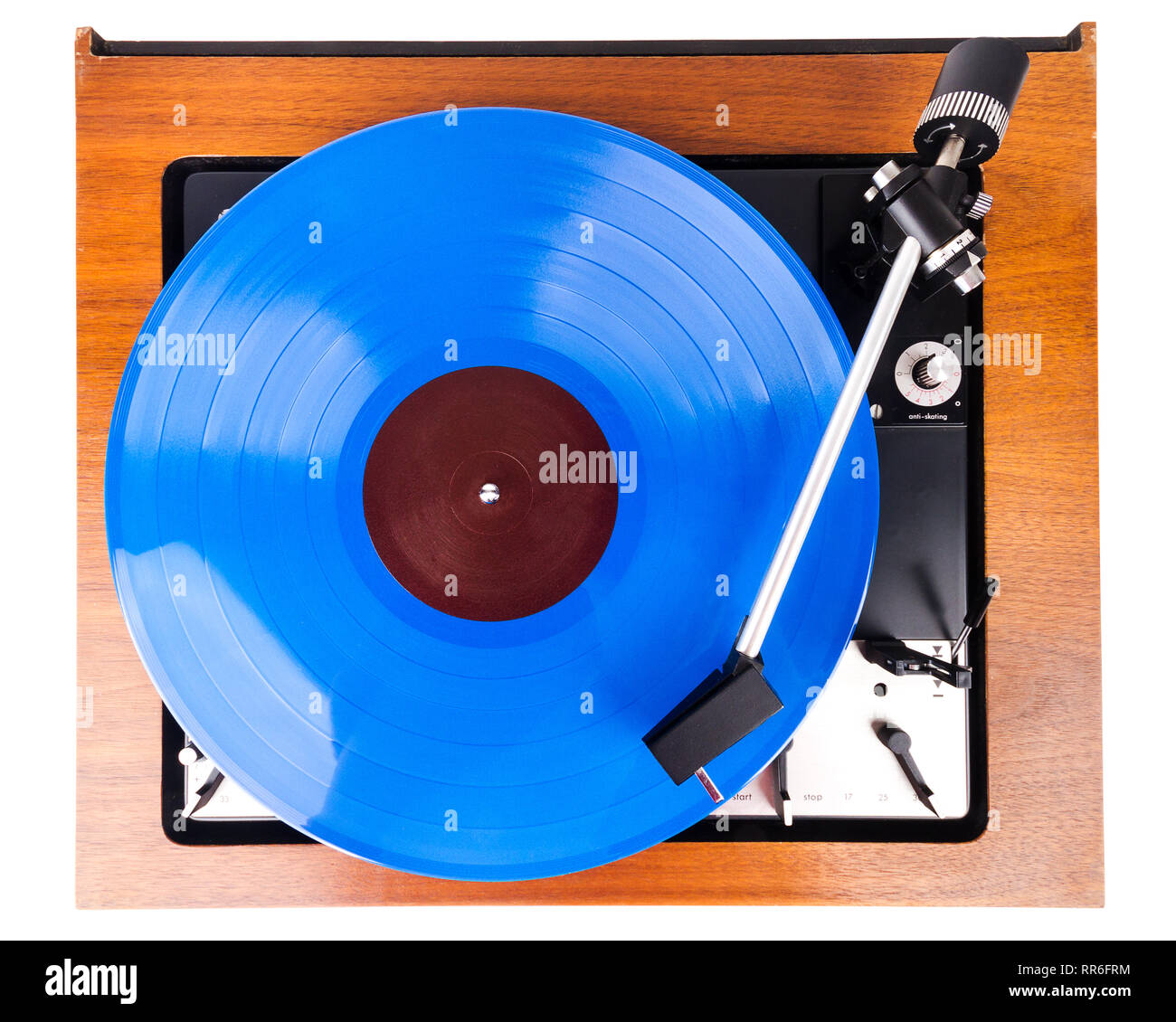 Vintage turntable with a blue vinyl isolated on white. Wooden plinth ...