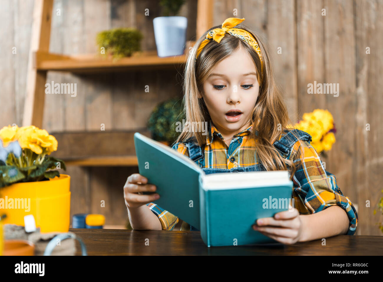 selective focus of shocked kid reading book Stock Photo - Alamy